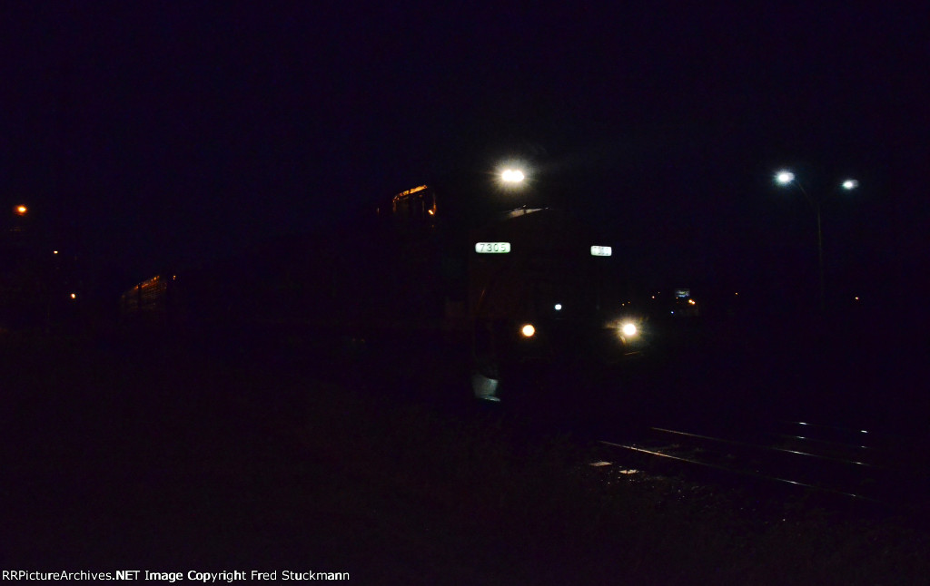 CSX 7305 is an ex Con moving under the cover of darkness.